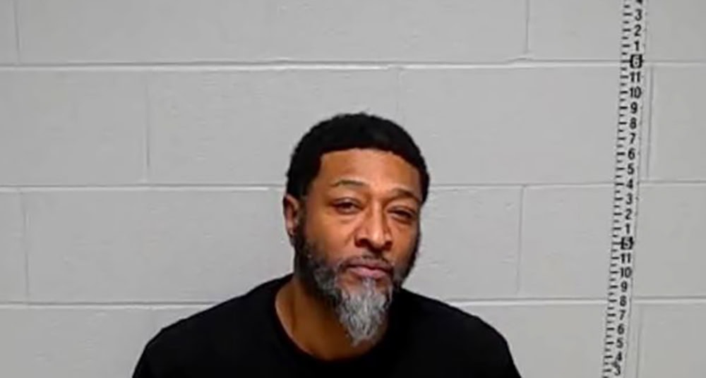 Man wanted for striking woman found with loaded, stolen gun by officers ...