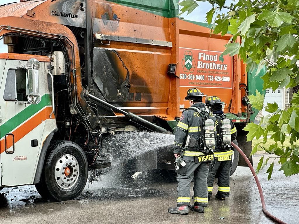 Firefighters extinguish fire that engulfed part of garbage truck in ...