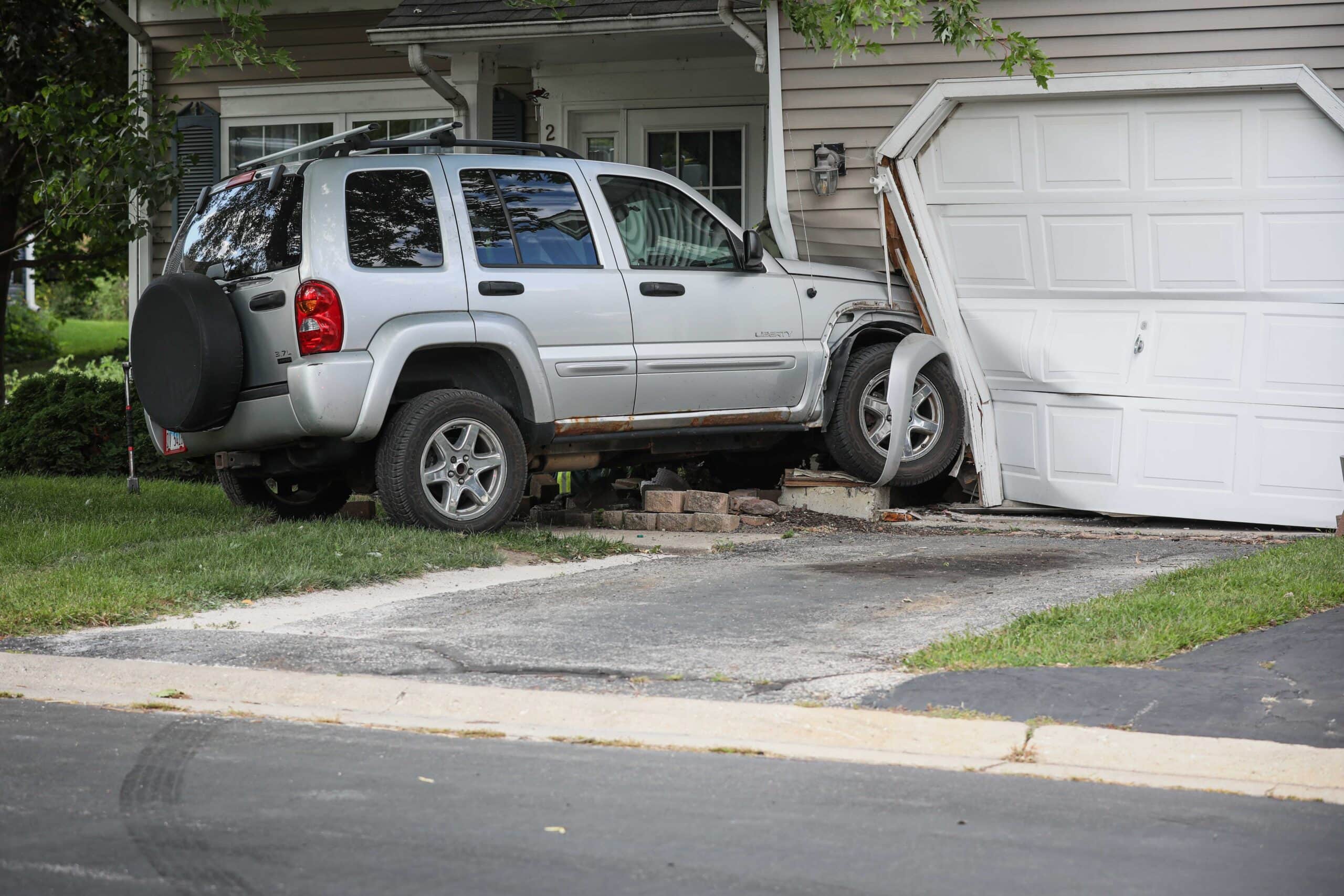 No injuries reported, two residences evacuated, after car hits house in ...